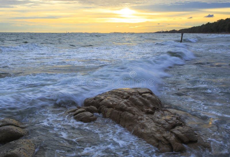 Sea wave and rock sunset stock image. Image of shiny - 32087241