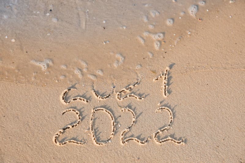 Sea Wave Rolling Onto Sandy Beach with Written 2021 and 2022. New Year ...