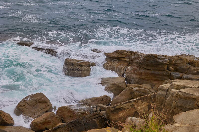 A Sea Wave Rolls Onto Coastal Rocks Stock Image - Image of travel ...