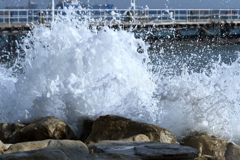 Sea wave splash on rocks stock photo. Image of white - 170754208