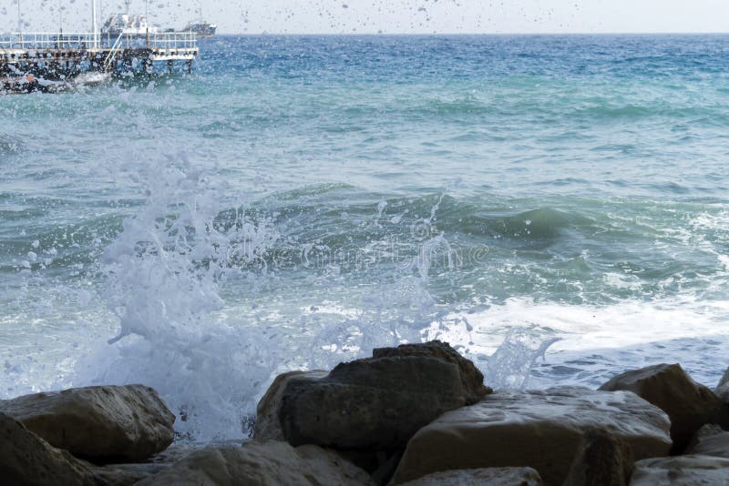 Sea wave splash on rocks stock image. Image of background - 166321813