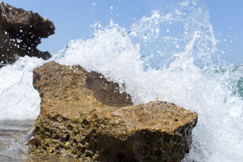 Sea Wave Splashing Over the Shore Rocks with a High Sea Spray Stock ...