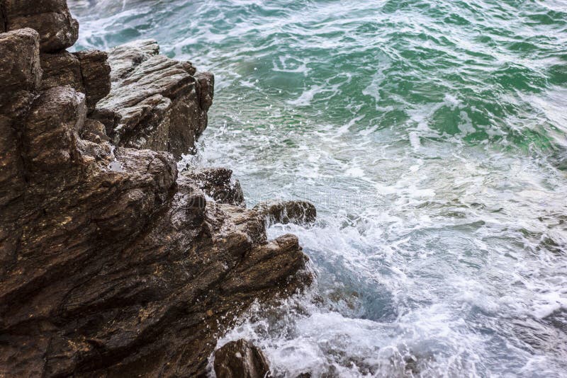 Sea waves against rocks stock photo. Image of green, stone - 54475830