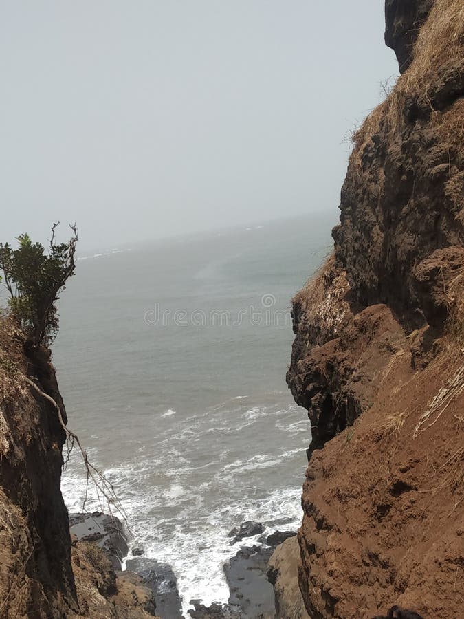 Sea waves along the cliffs stock image. Image of rock - 247962195