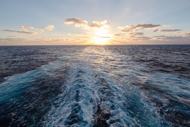 Sea Waves Behind the Ship at Sunset Stock Photo - Image of speed ...