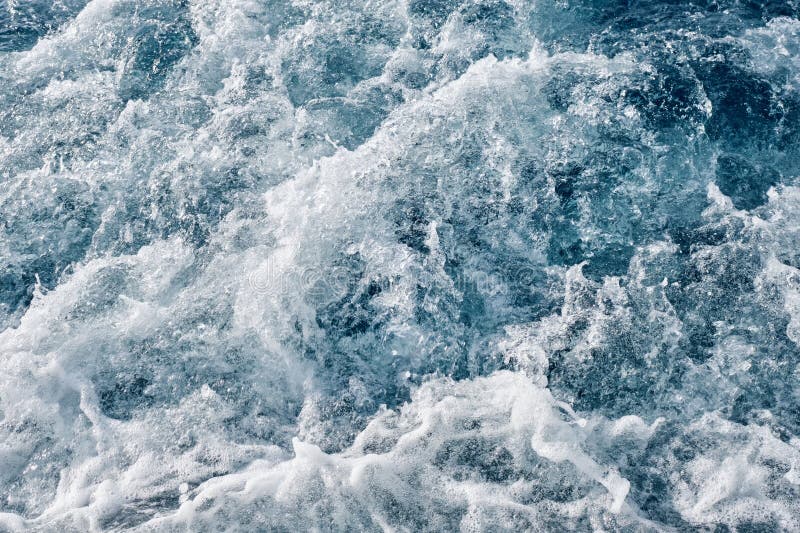 Sea Waves, Bubbles and White Foam Over the Blue Sea Formed by the Motor ...