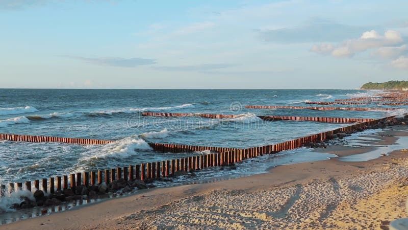 Sea Waves on the Coast with Wave Breakers Stock Footage - Video of ...