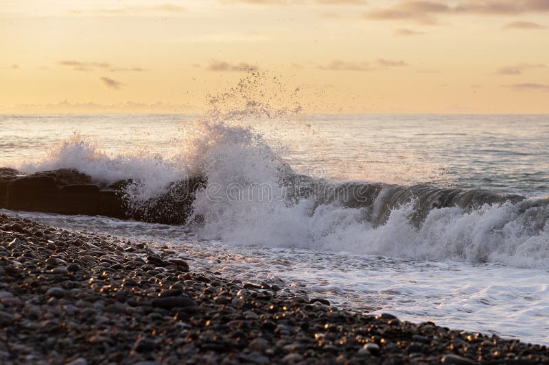 Sea Waves Crashing on a Pebbly Shore on the Sunset Stock Photo - Image ...