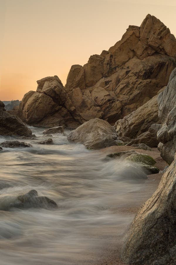 Sea Waves Hitting the Big Rocks. Stock Image - Image of sunset, blurred ...