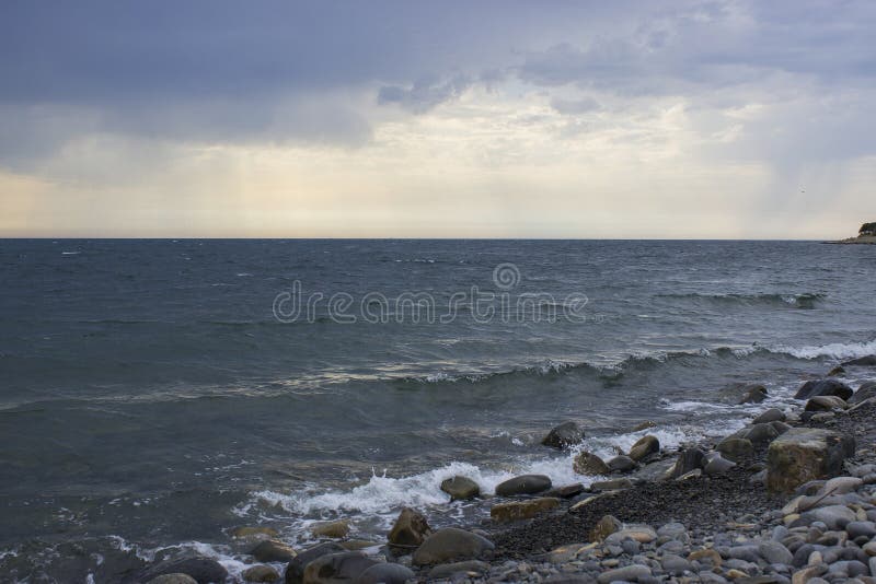 Sea waves and overcast sky stock photo. Image of rain - 144494598