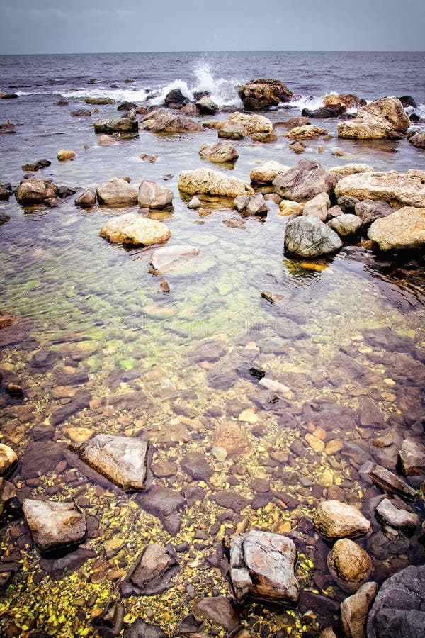 Sea waves and rocks stock photo. Image of picturesque - 23779776