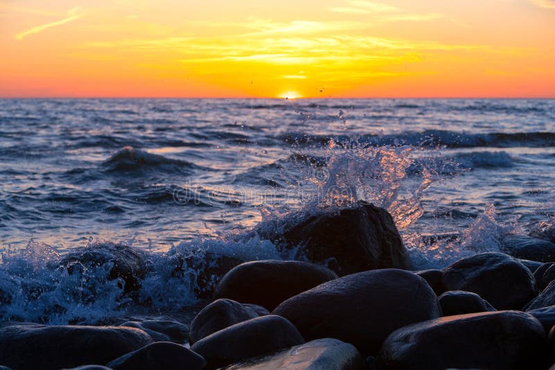 Sea Waves Run Over Stones in the Evening Stock Photo - Image of ...