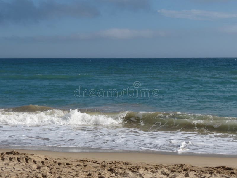 Sea waves with white caps stock image. Image of sand - 192042143
