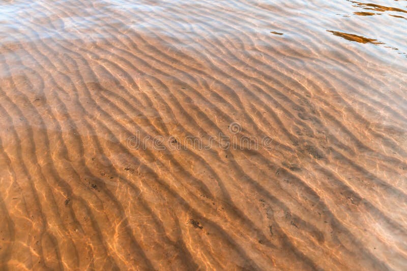 Seabed with Wavy Pattern on Sand Under Shallow Water Stock Image ...
