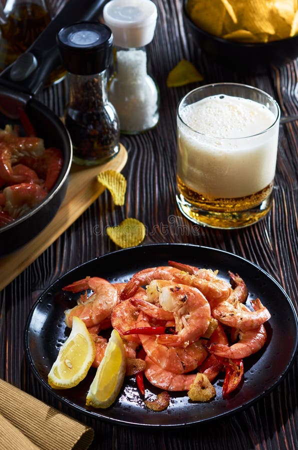 Seafood at the Bar, Composition of Black Plate with Shrimp Lemon Beer ...