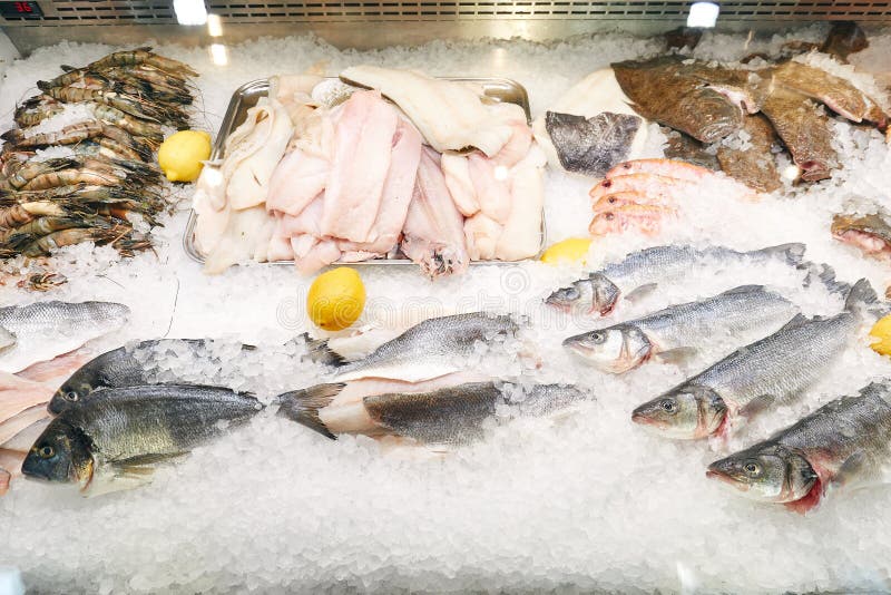 Seafood on Display in Ice, Crayfish, Various Fish, Lemon Stock Image ...