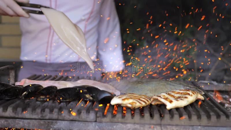 Seafood on the Grill. Mussels, Shrimp, Squid and Fish are Cooked on ...