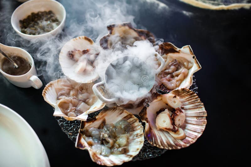 Seafood on Plates in the Form of Shells Stock Photo - Image of cooking ...