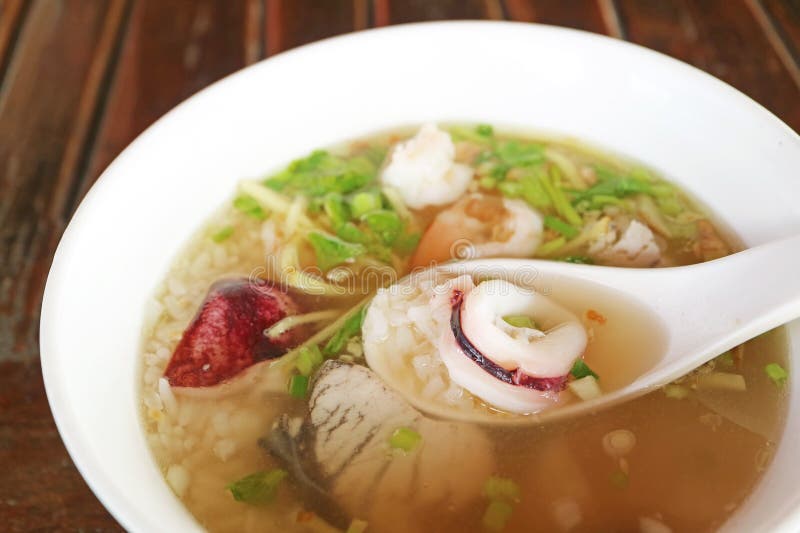 Seafood Rice Porridge with Squid in a Spoon Stock Photo - Image of ...