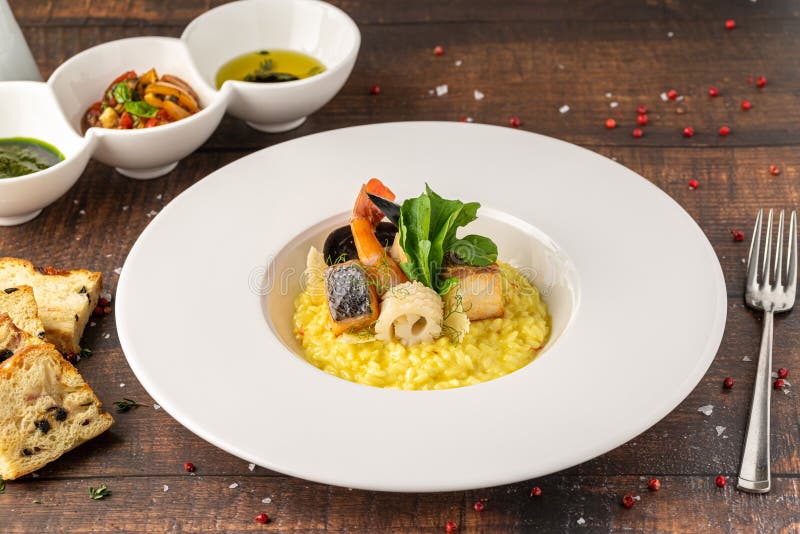 Seafood Risotto, Risotto Alla Pescatora, Served on a White Porcelain ...