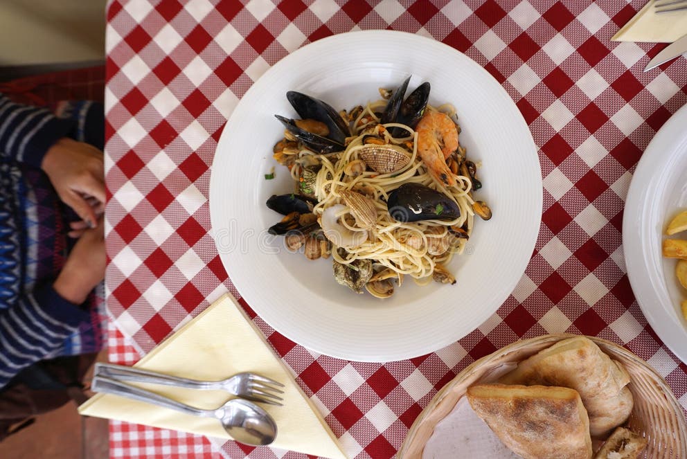 Seafood Spaghetti on Red Checker Board Table Stock Image - Image of ...