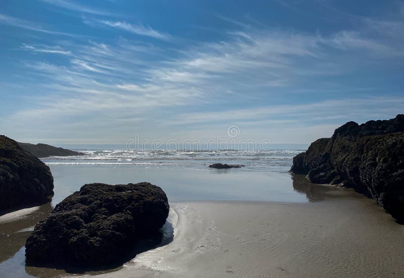 Seagulls at Cannon Beach and Haystack Rock at the Background Stock ...