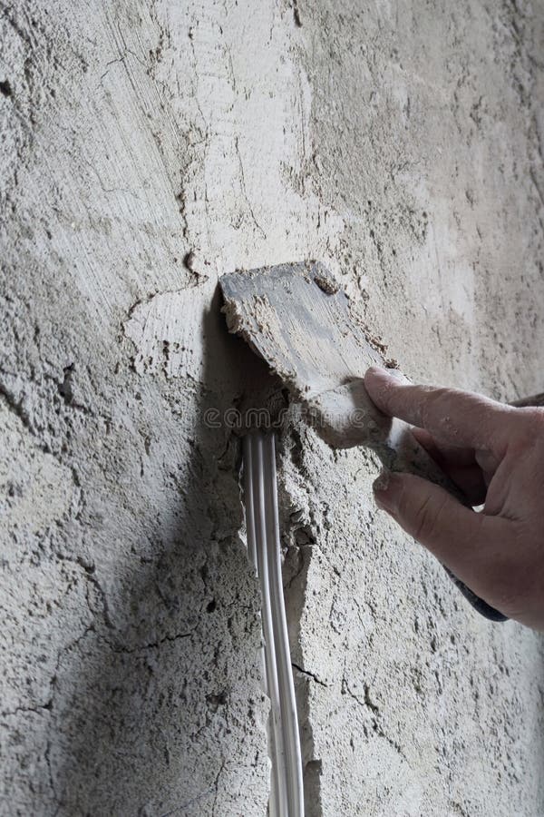 Cable Cementing in the Wall with Cement Mortar Stock Photo - Image of ...