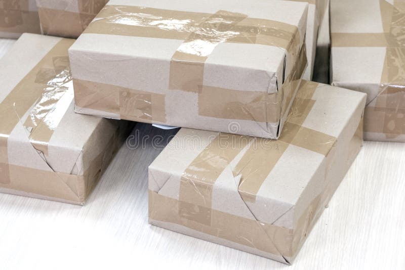 Boxes are Sealed One of Them is Torn and Visible Sheets of White Paper ...