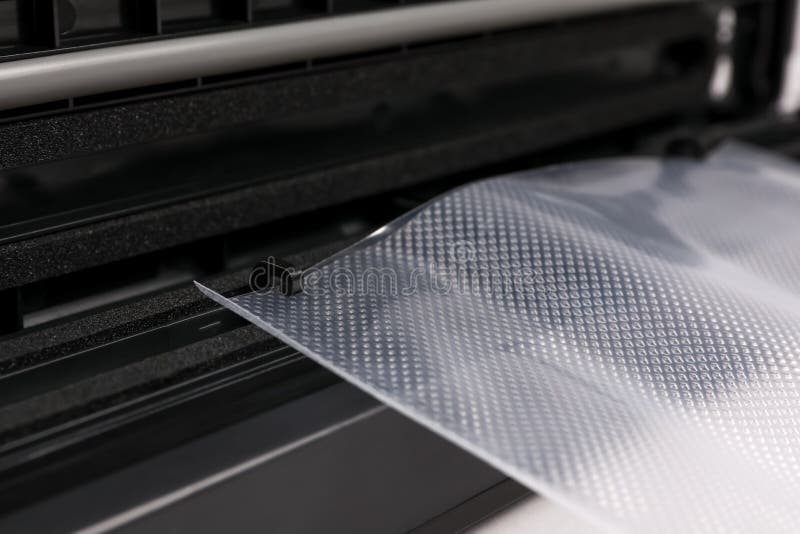 Sealer for Vacuum Packing with Plastic Bag, Closeup Stock Photo - Image ...