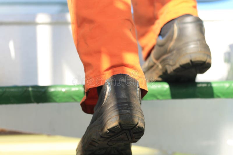 Seaman at work. stock photo. Image of hand, seaman, footwear - 263205630