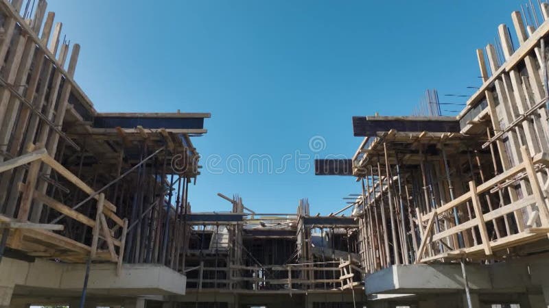 Aerial View: Skilled Workers Handle Metal Beams and Frameworks on a ...