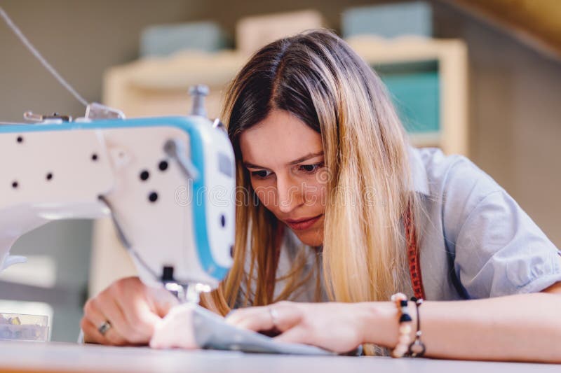 Seamstress Dressmaker Woman Working with Sewing Machine in Workshop ...
