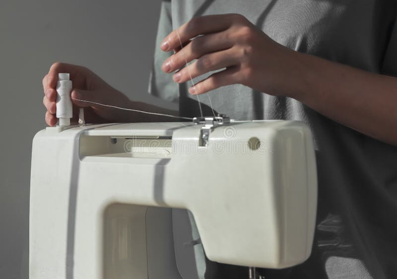 Seamstress Hands Putting Thread Spool on Sewing Machine Stock Image ...