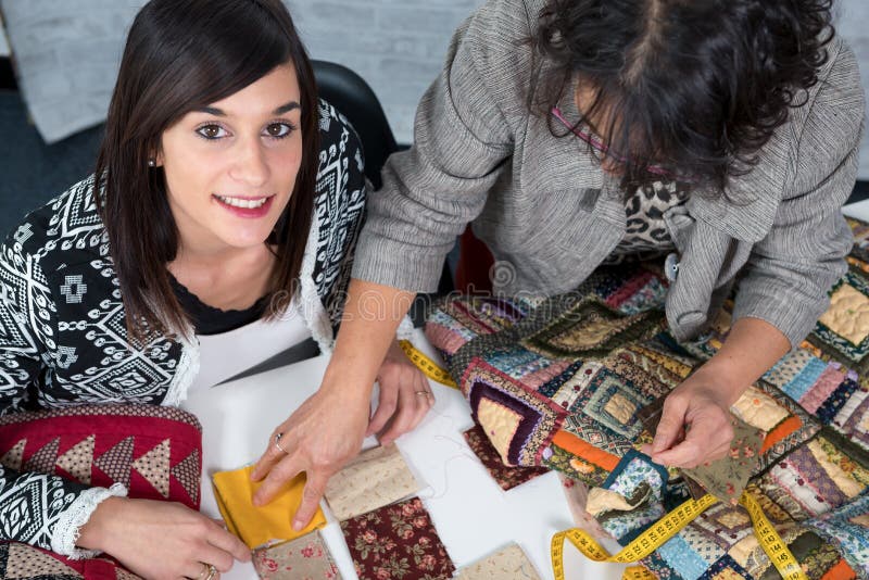 Seamstress and Her Apprentice with Fabric for Patchwork Stock Image ...