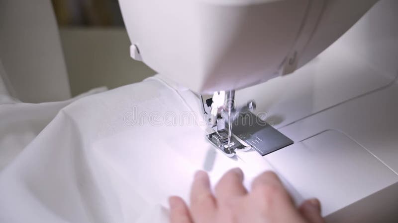 Seamstress Makes an Even Stitch on the Sewing Machine. Seamstress S ...