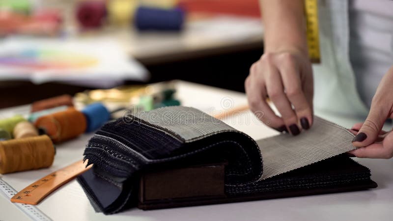 Seamstress Reviewing Fabric Samples Checking Their Quality before ...