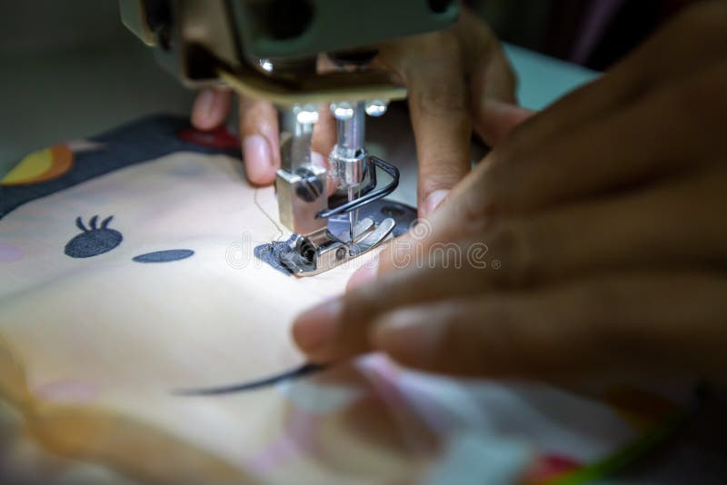 Seamstress Sews. Clothes Made on a Sewing Machine. Work by the Light of ...
