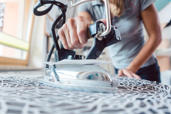 Tailor ironing fabric stock photo. Image of textile - 177966544