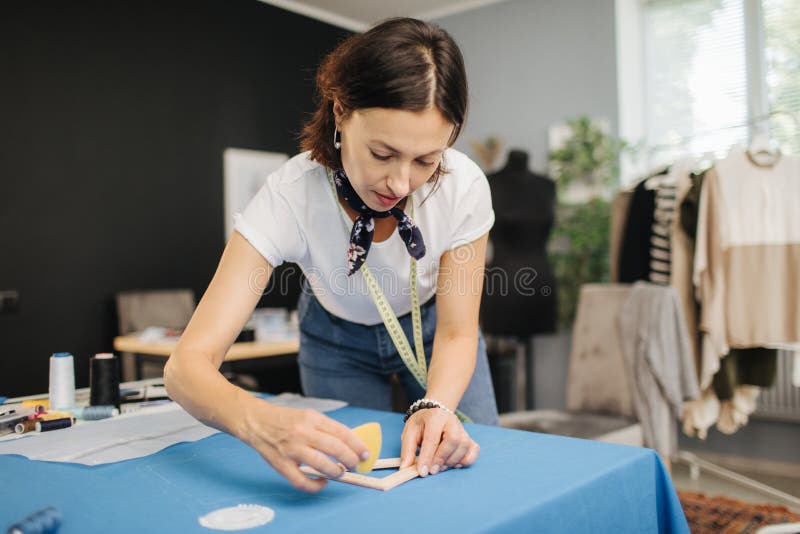 Seamstress Using Ruler and Soap while Working with Fabric Stock Photo ...