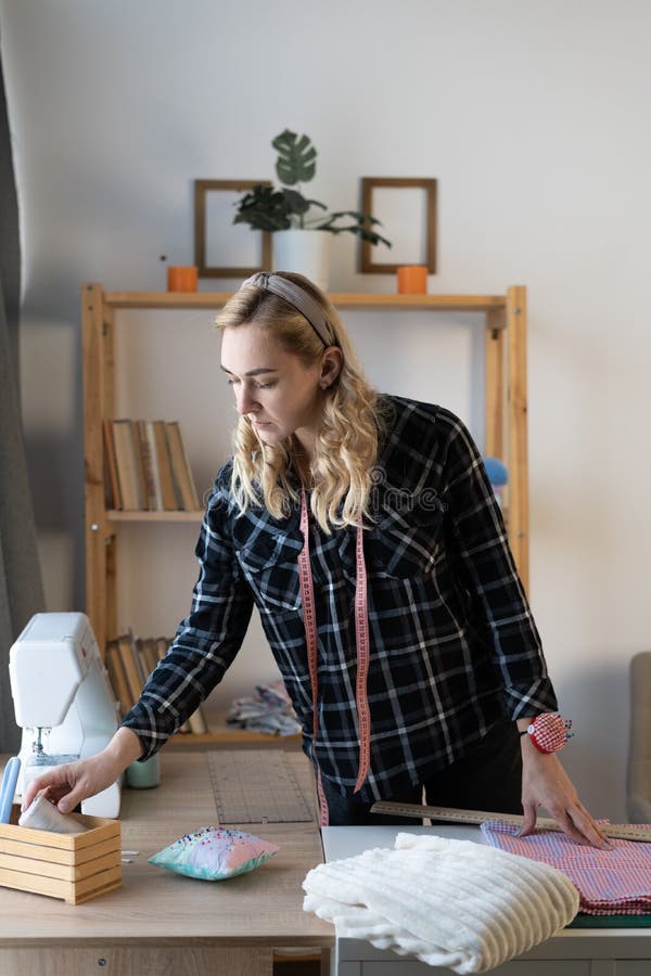 Seamstress at Work. Dressmaker Making Clothes in Modern Studio. Female ...