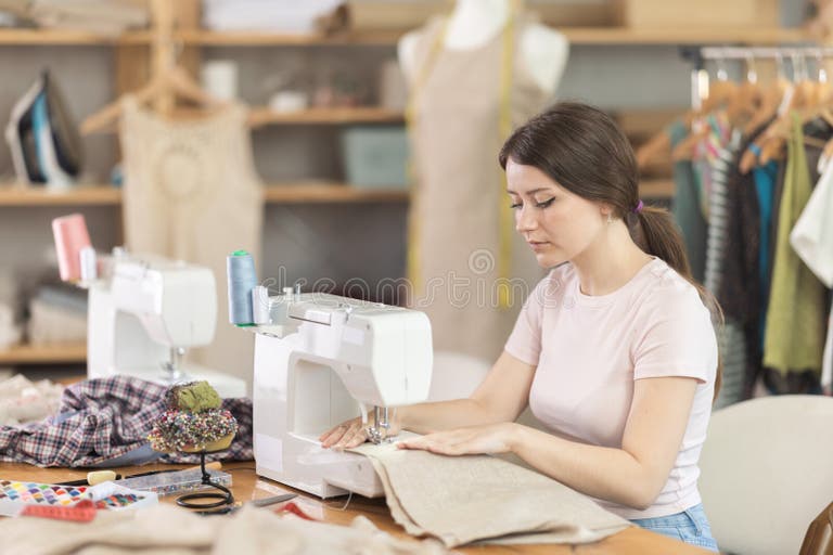 Seamstress Working on Modern Sewing Machine in Sewing Workshop Stock ...
