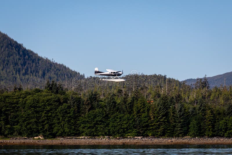 Seaplane / Float Plane Flying Over the Water Stock Photo - Image of ...