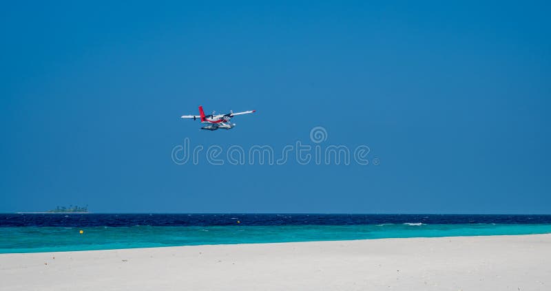 Seaplane Fly Low Above Sea Level by the Sandy Beach Editorial ...