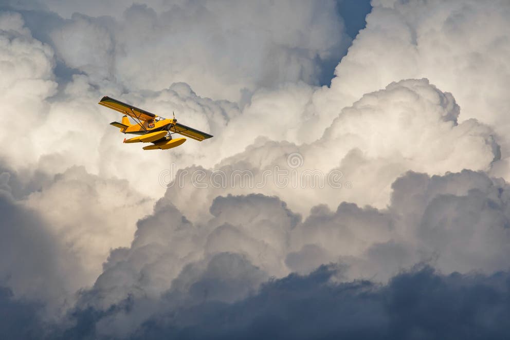 Seaplane flying in the sky stock photo. Image of fuselage - 205614944