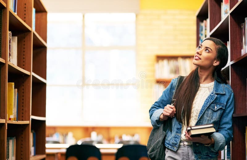 Searching for the Book she Needs. a University Student Looking for a ...