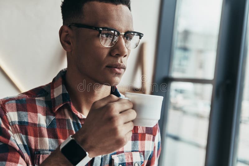 Searching for Inspiration. Handsome Young Man Drinking Coffee an Stock ... Searching for Inspiration. Handsome Young Man Drinking Coffee an Stock ...