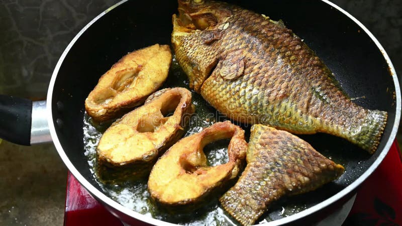 Seared Fish Cooked on Pan Frying. Fresh Fish Fried on Hot Oil Pan Stock ...