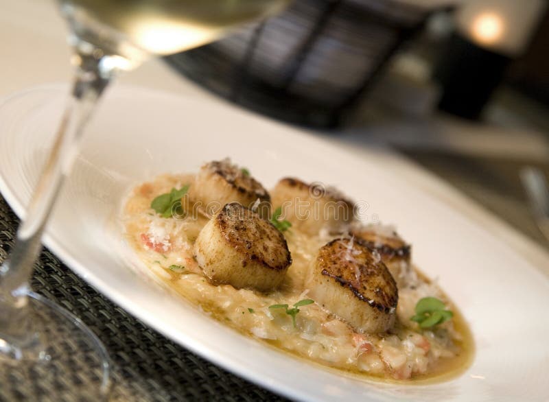 Seared Sea Scallops on Risotto Stock Image - Image of delicious, glass ...
