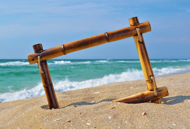 Seascape with Bamboo Frame on the Beach Sand Stock Image - Image of ...