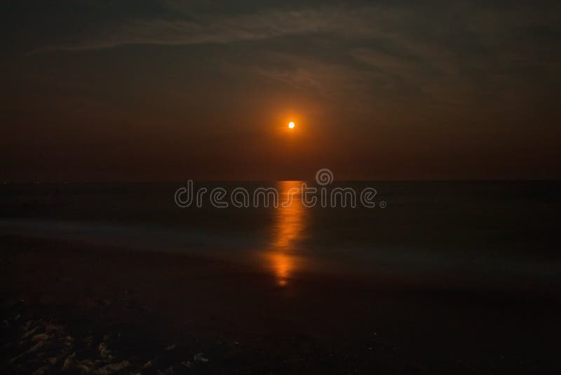 Seascape with a red moon stock photo. Image of night - 82922304